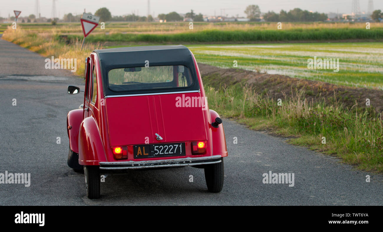 Red Citroën 2CV photographed in rural environment (Milan, Italy Stock ...