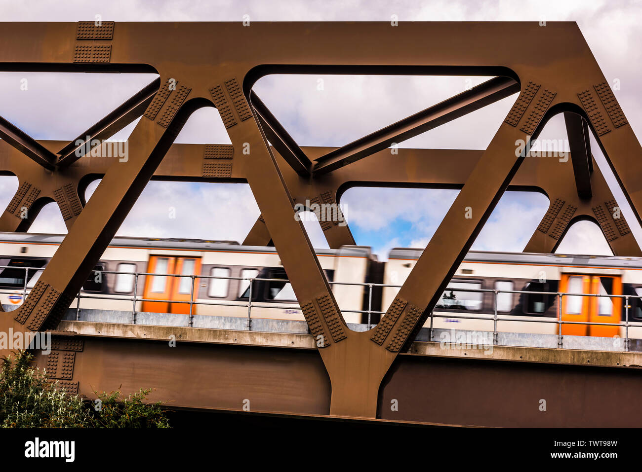 Diagonal view of a train passing at speed on the GE19 Bridge ...