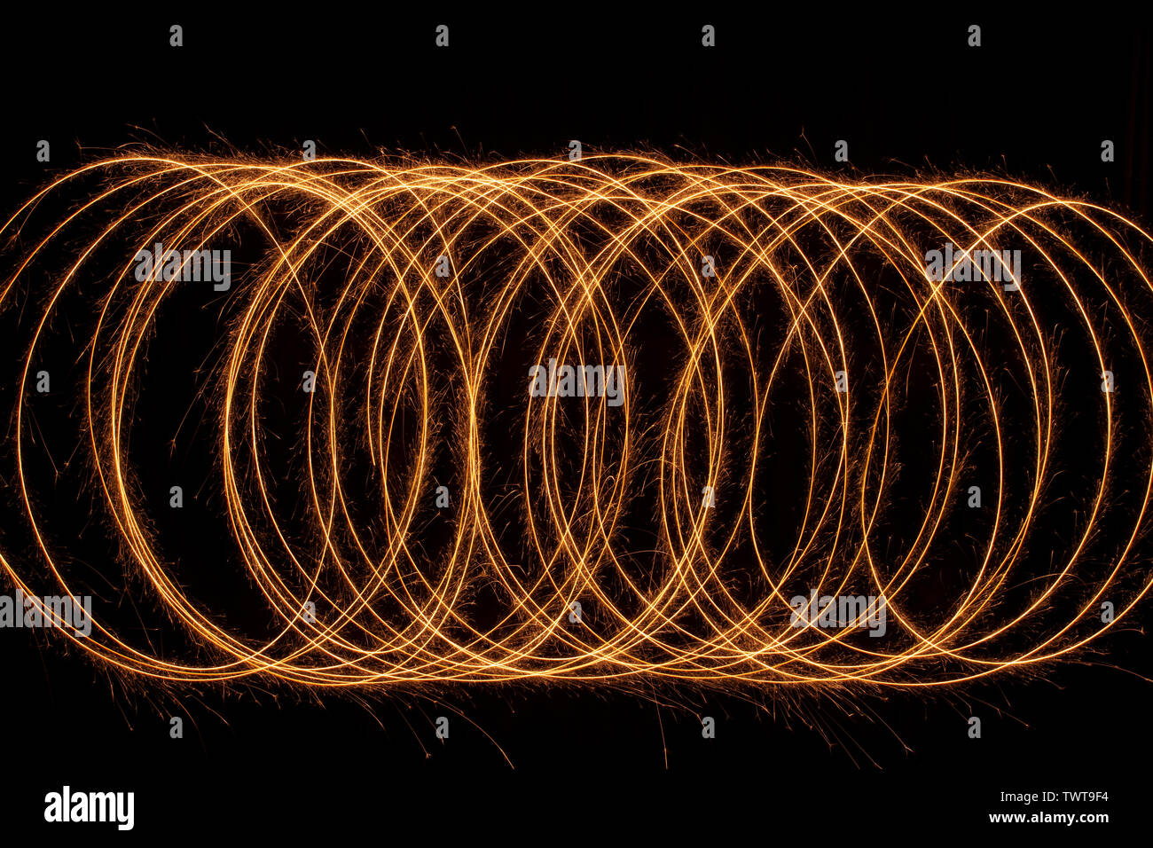 Sparkle golden glowing shiny spiral lines and circle light effect ...