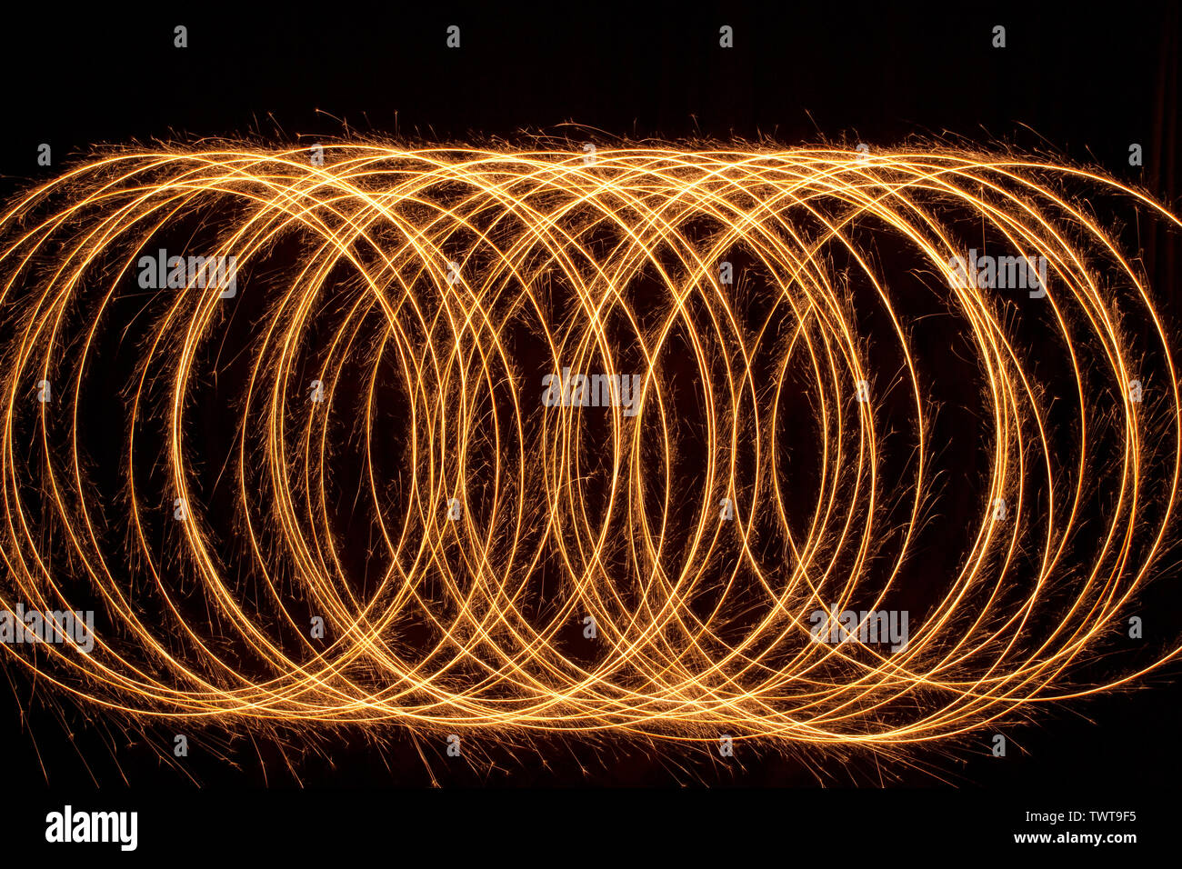 Sparkle multiple circle shape. Burning fire sparklers isolated on black ...