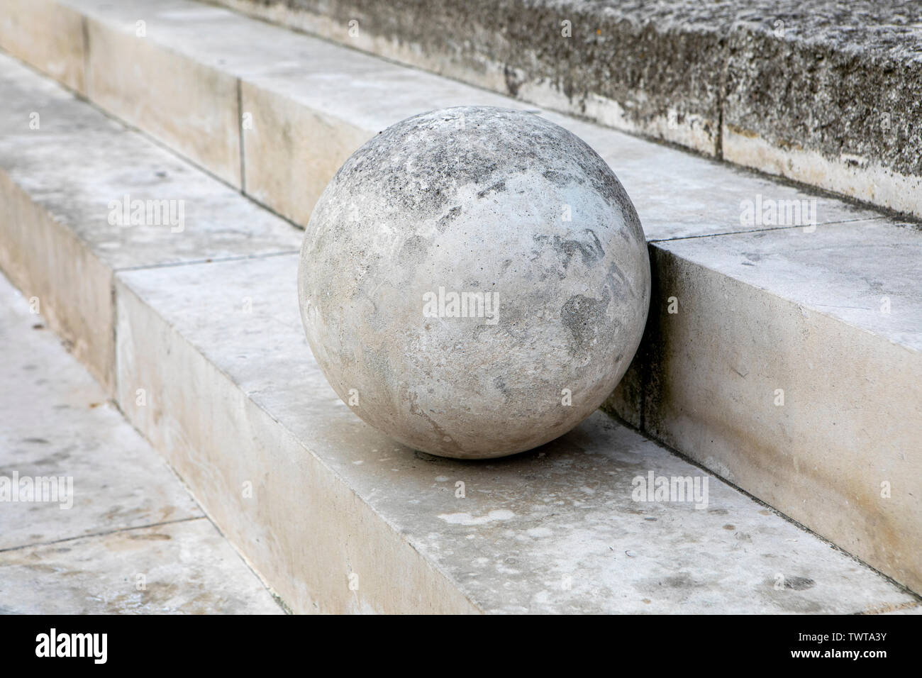 A stone ball on stone steps Stock Photo - Alamy