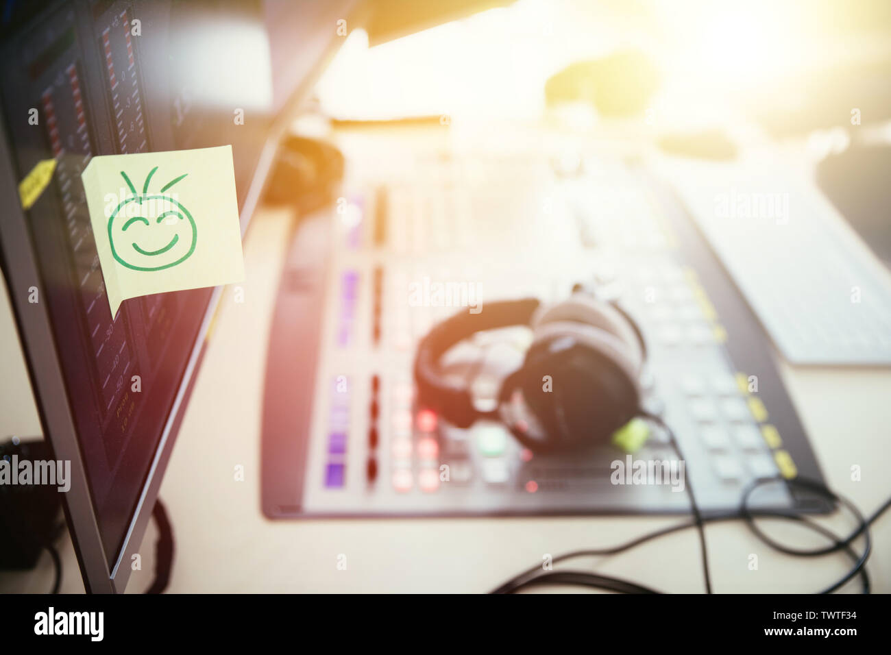 Smiley illustration at a radio studio, metaphor for feedback and ...