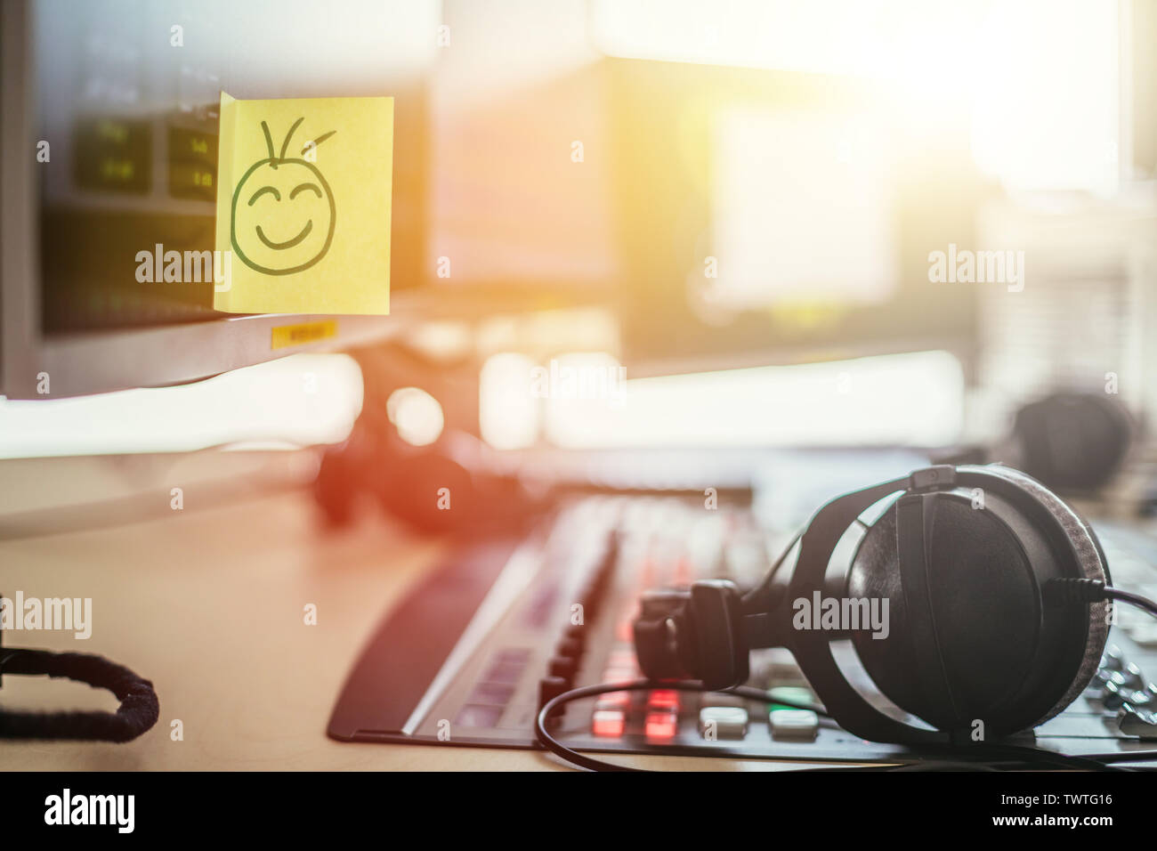 Smiley illustration at a radio studio, metaphor for feedback and ...