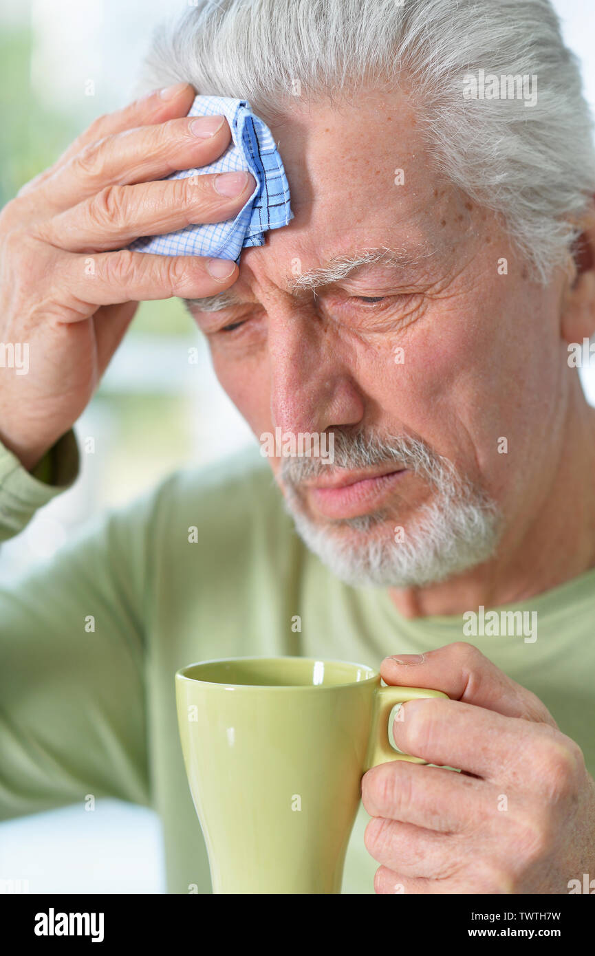 Portrait of sad sick senior man with headache Stock Photo - Alamy