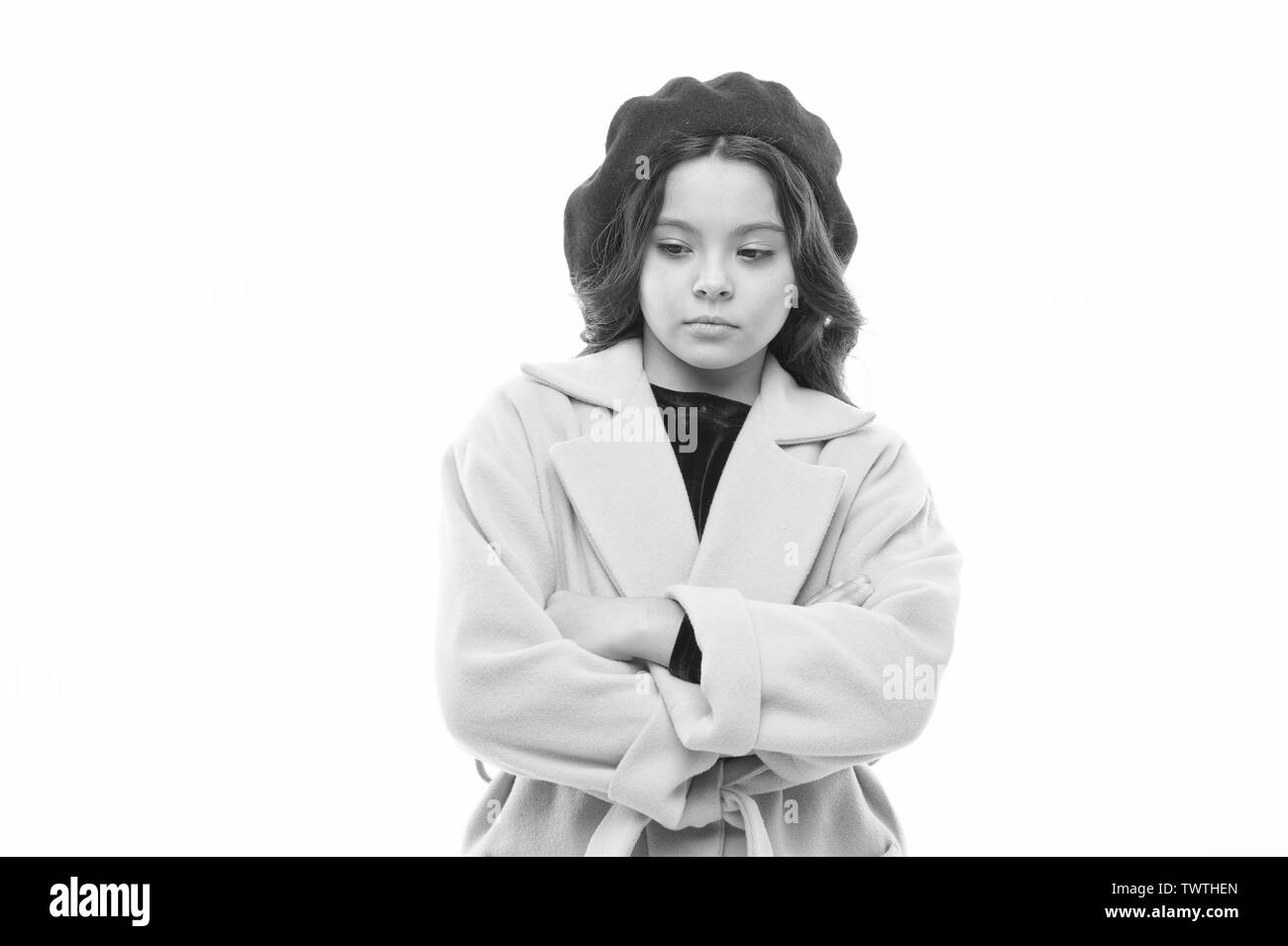 Sad child. Sadness concept. Girl kid wear coat hat stand with crossed ...