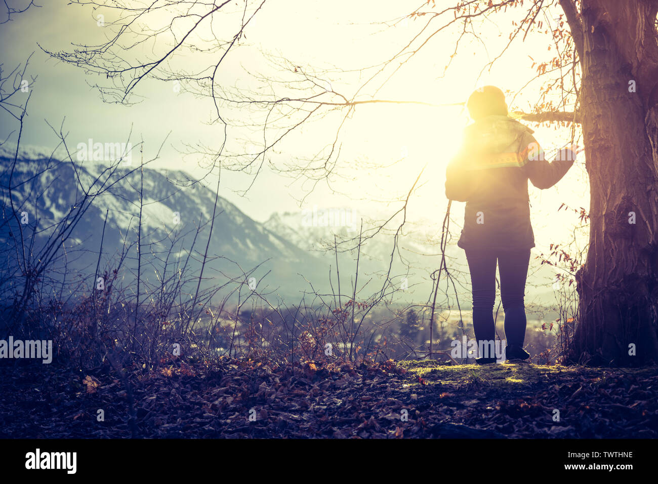 Young standing girl is enjoying the sunset scenery, winter time Stock ...
