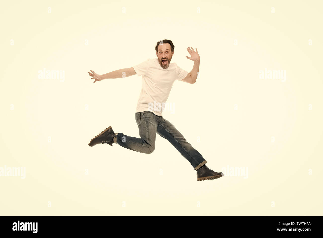 Explosion of positive emotions. Man excited jumping. Mature charismatic ...
