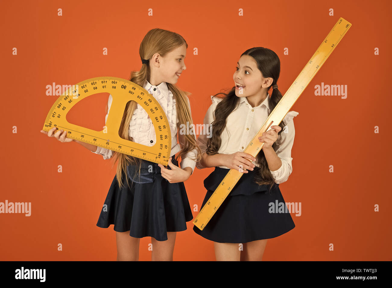 For good measure. School children with measuring instruments. Little ...