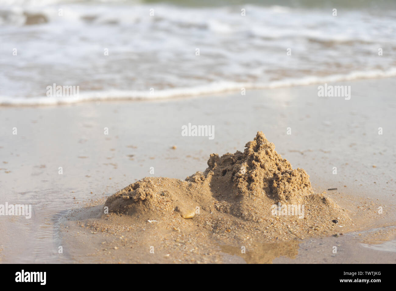 Sand castles destroyed by sea water But the remains of the ruined soil ...