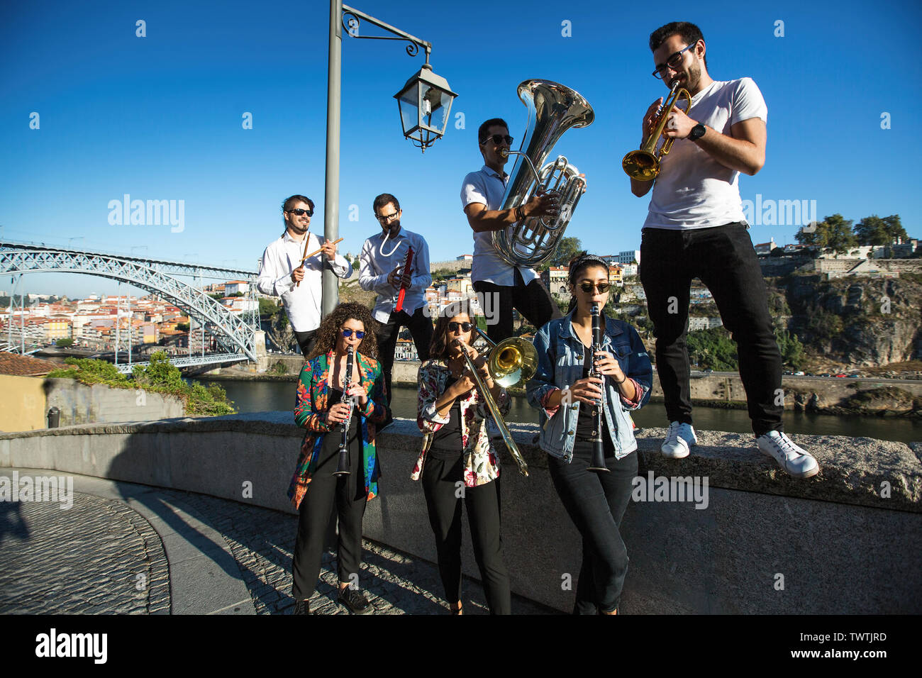 Group of Jazz musicians with wind instruments playing on the street ...