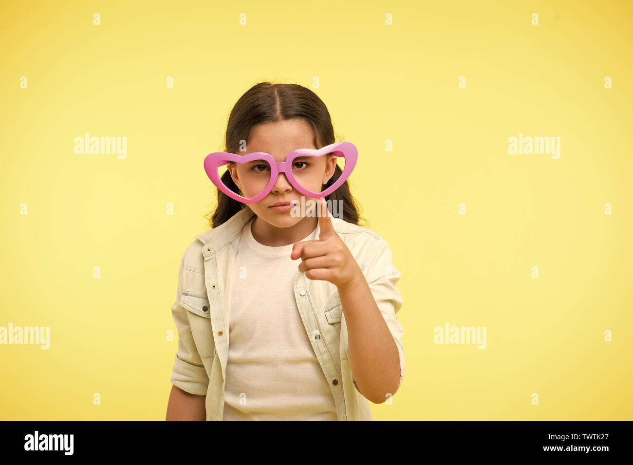 You send me valentines card. Child calm strict face pointing forward ...