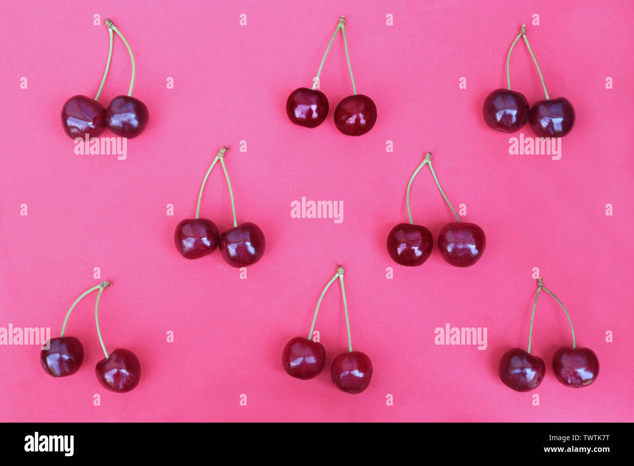 red pattern with cherry twins, flat lay Stock Photo - Alamy