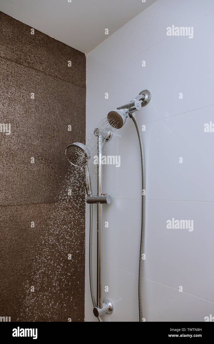 Shower head with water drops splashing on a bathroom Stock Photo - Alamy