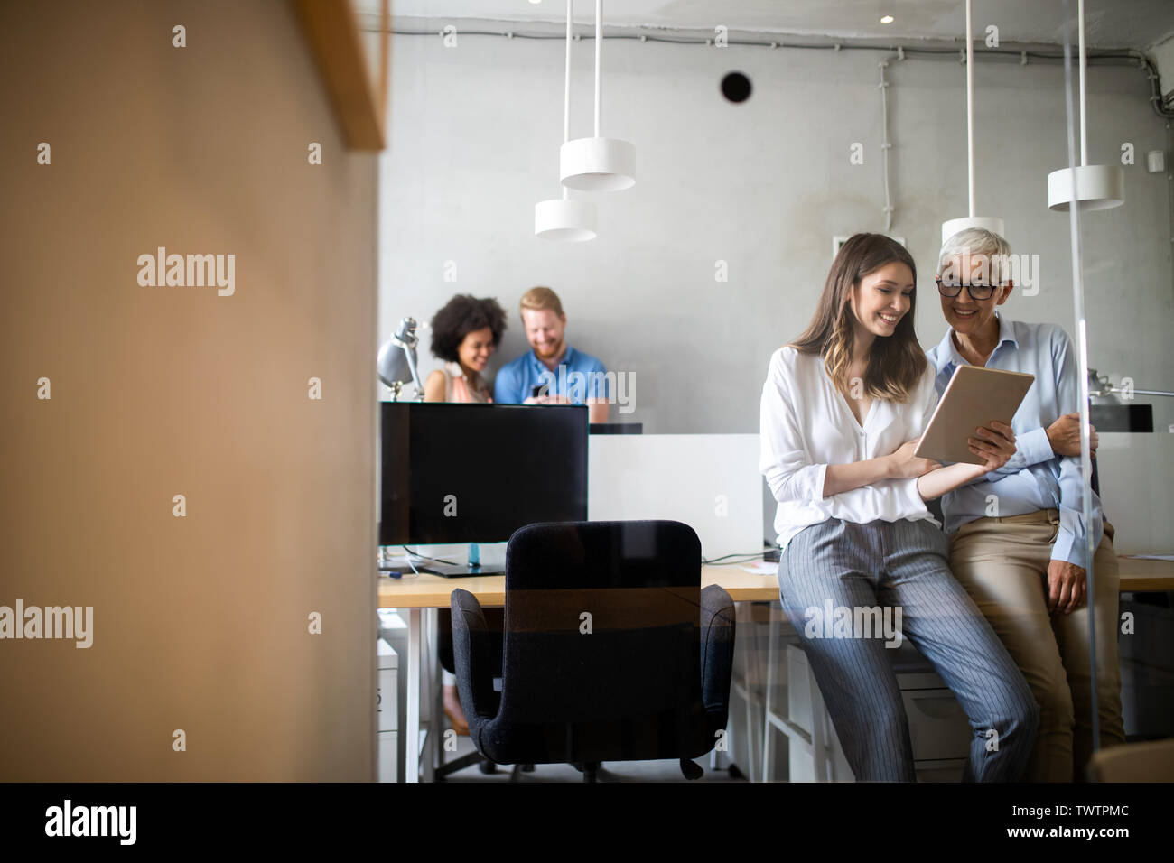 Programmer working in a software developing company office Stock Photo ...