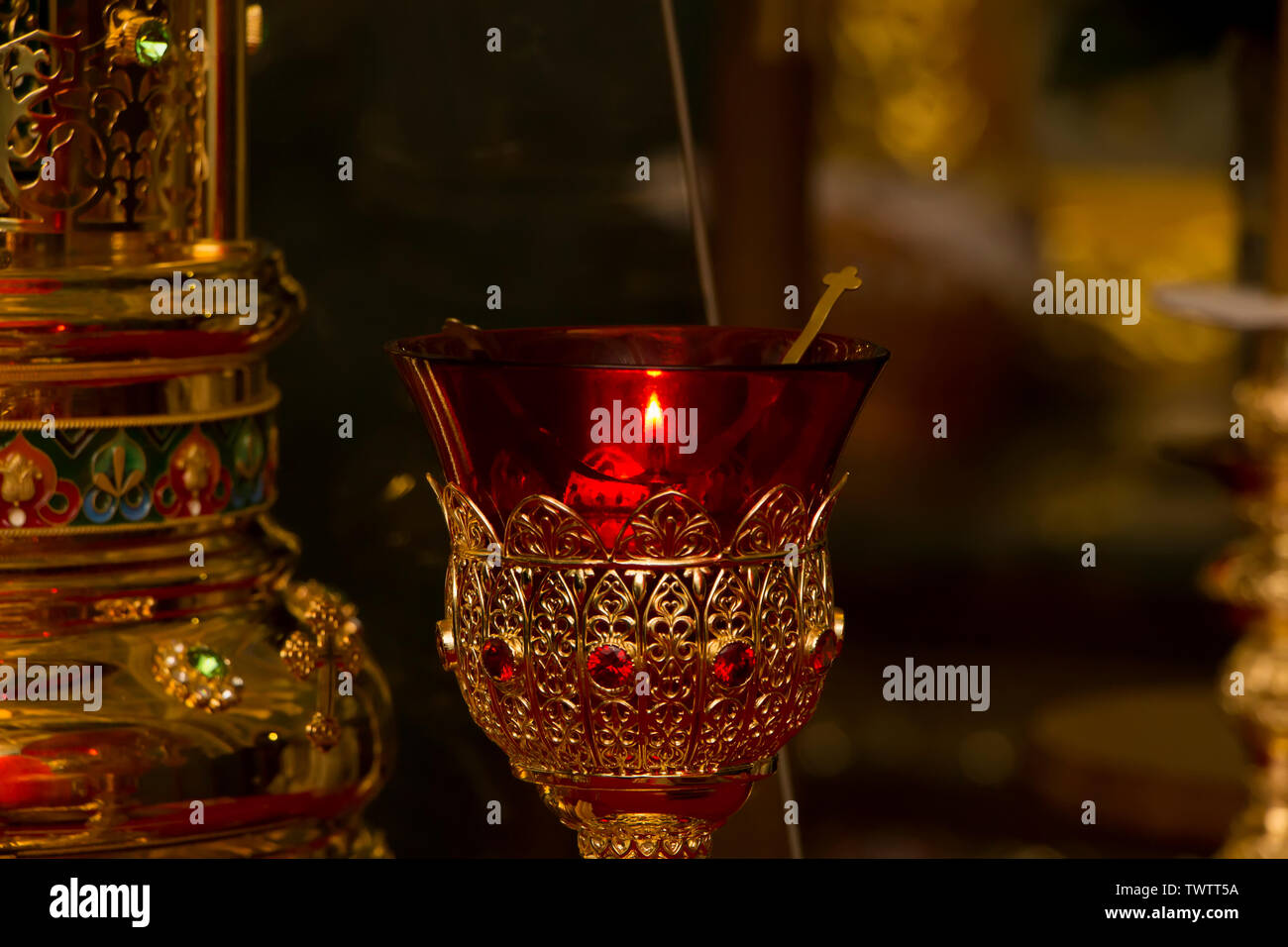 Burning fire flame in oil icon lamp. Orthodox church. Old style gilding ...