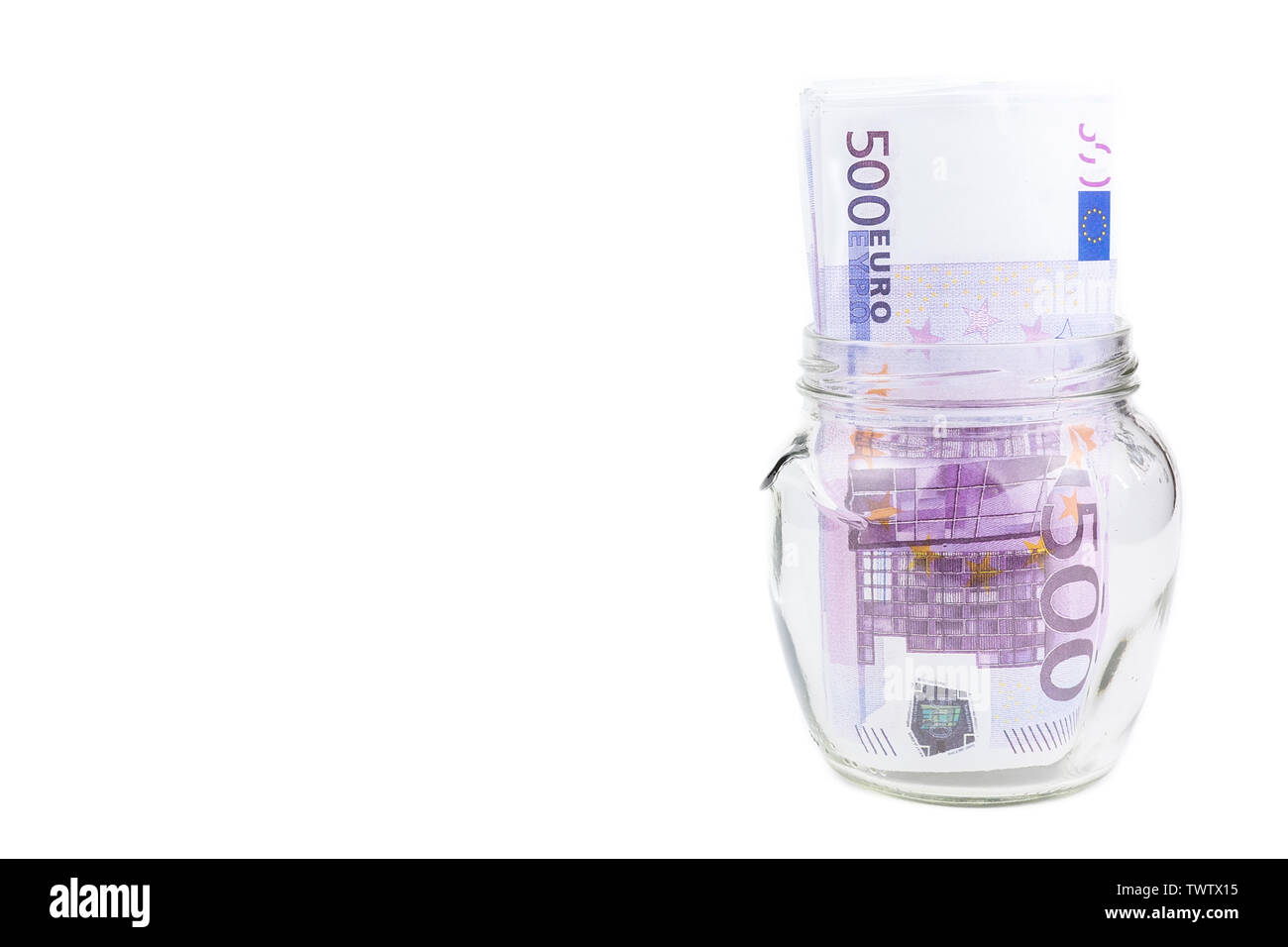 Euros saved in a glass jar on a white background Concept to save money ...