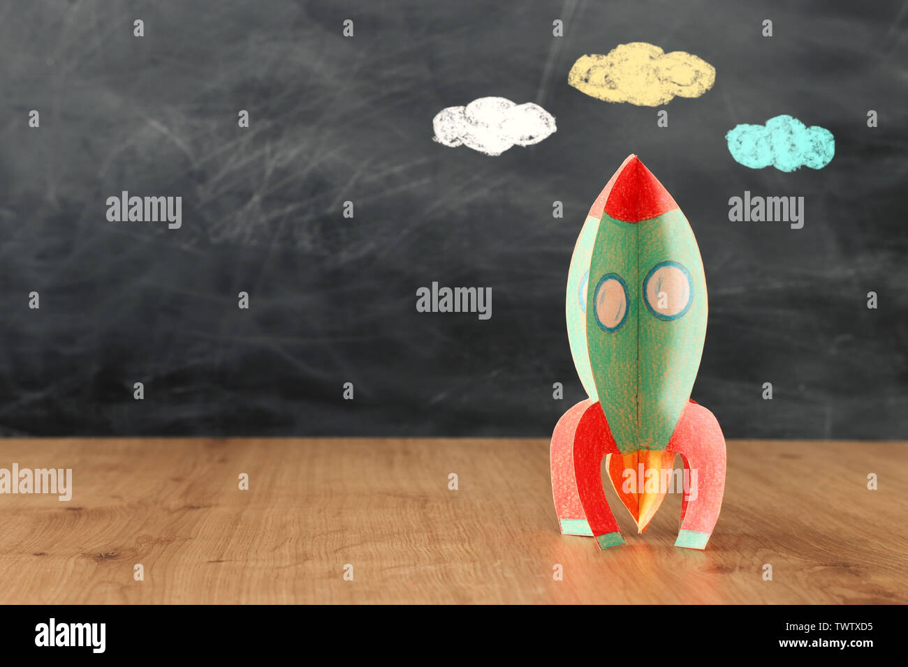 education and back to school concept. cardboard rocket in front of ...