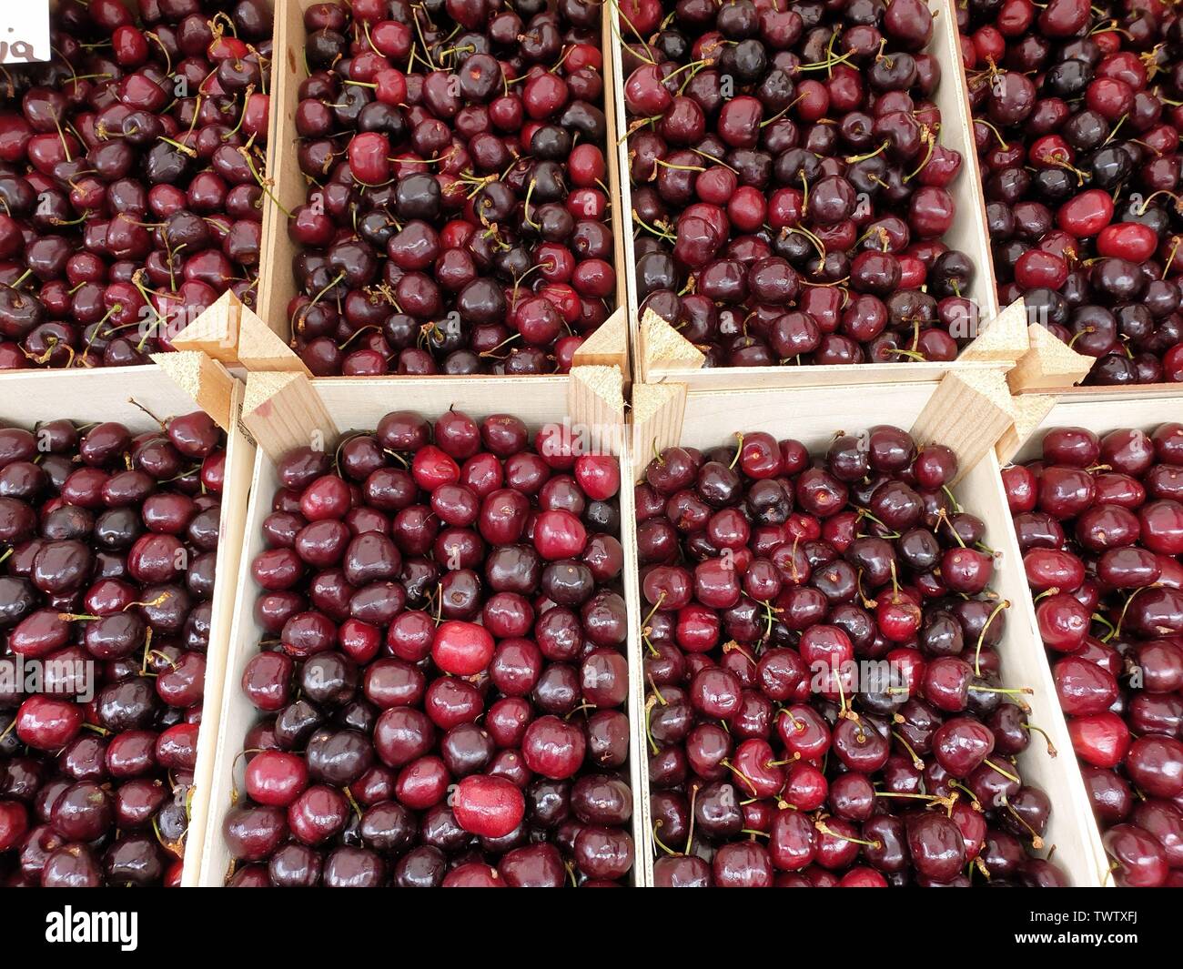Image of fresh red cherries in wooden boxes Stock Photo - Alamy