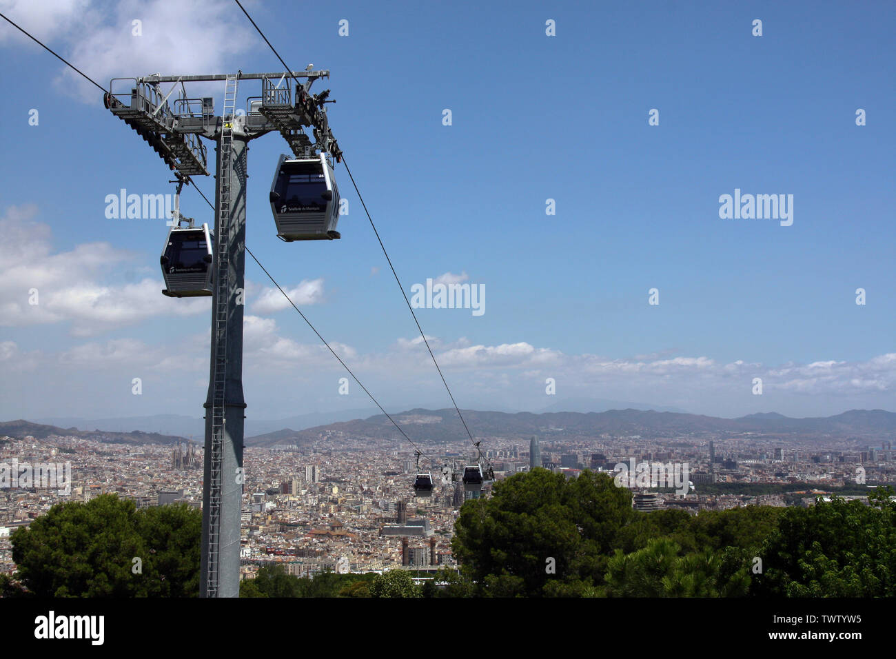 Cable Car over Barcelona in the hot summer sun Stock Photo - Alamy