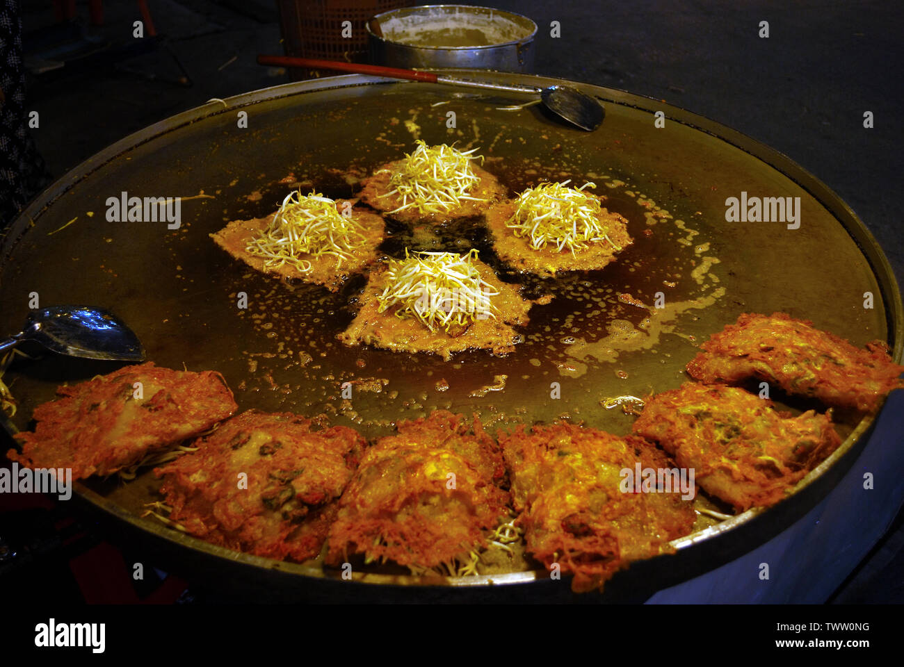 Fried shells in a large pan that are being finished are appetizing ...