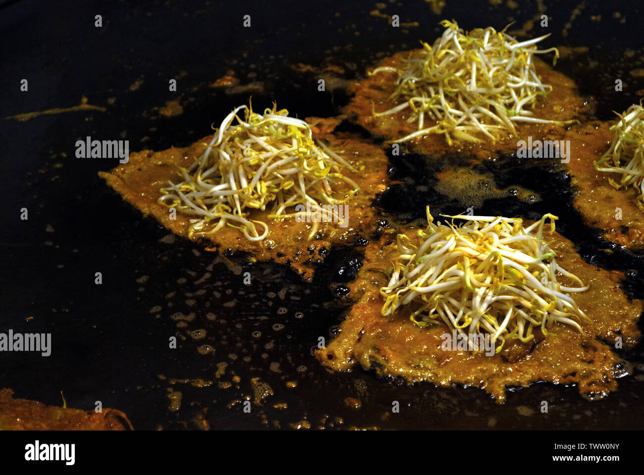 Fried shells in a large pan that are being finished are appetizing ...