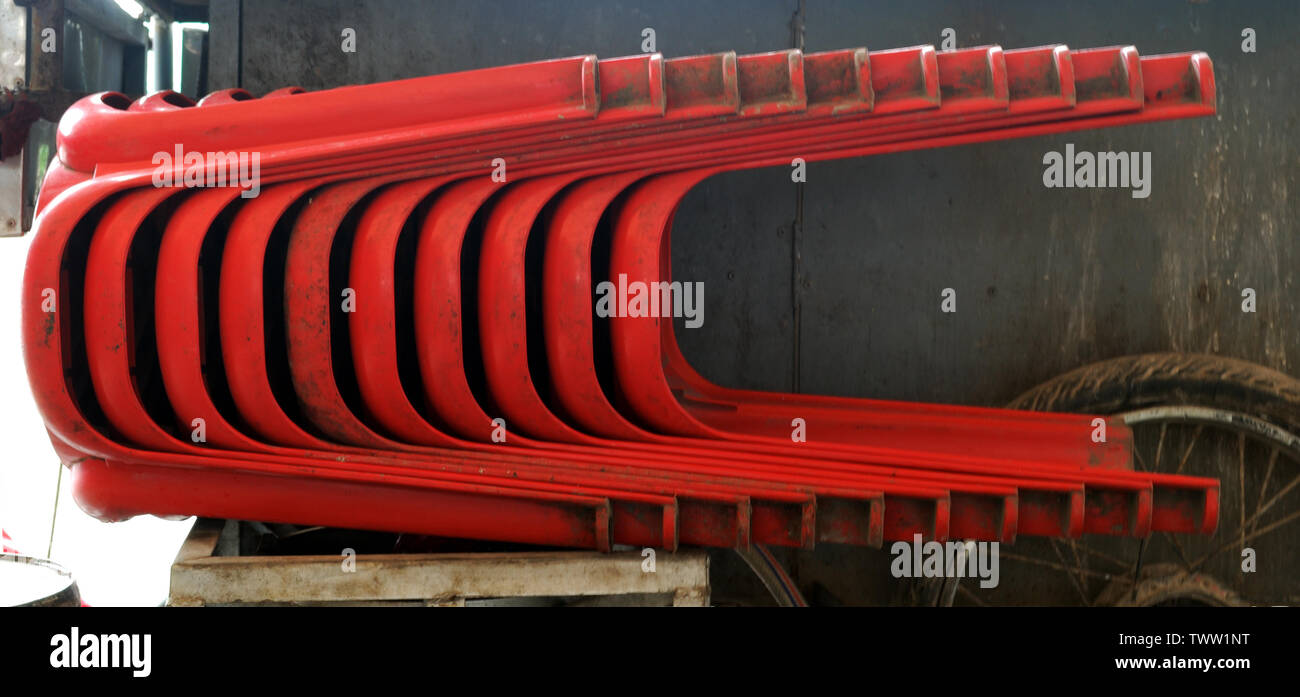 Stacked red plastic chairs hi-res stock photography and images - Alamy