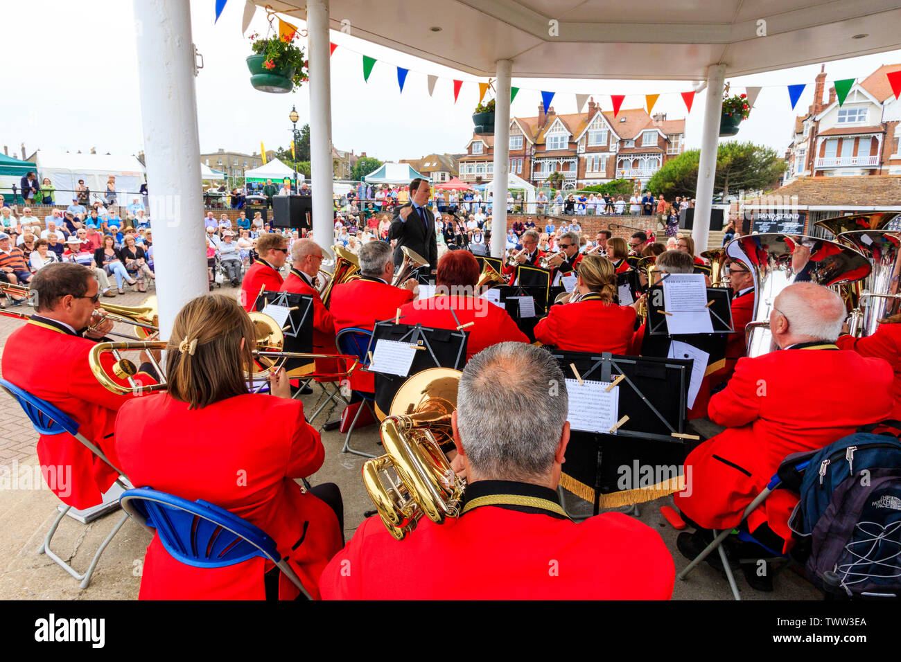 Broadstairs bandstand on the seafront. Band, orchestra dressed in red ...