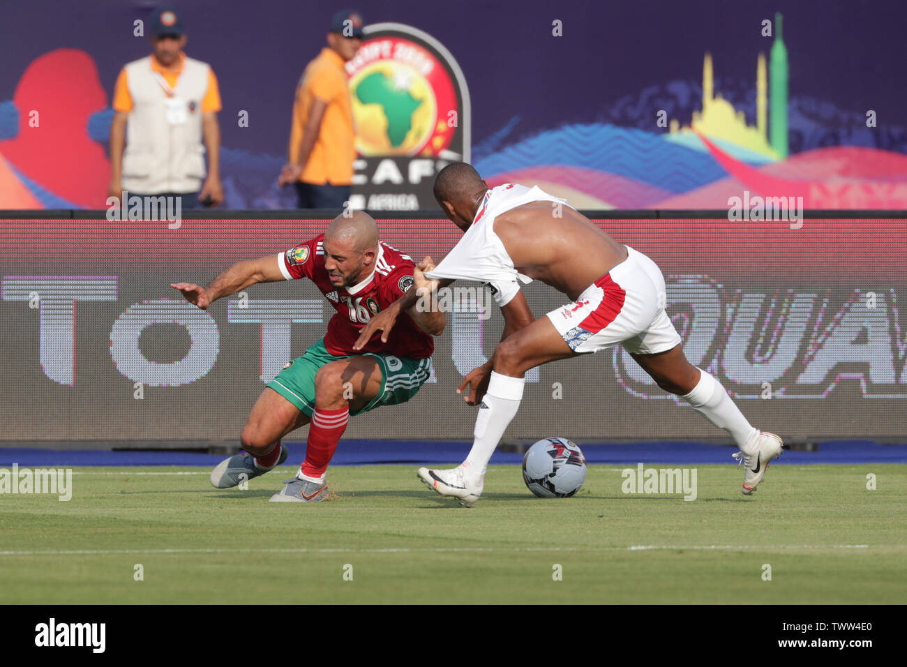 Cairo, Egypt. 23rd June, 2019. Morocco's Noureddine Amrabat (L) pulls ...