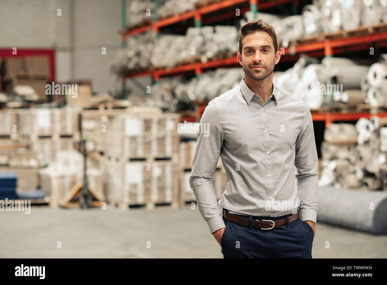 Warehouse manager standing on the floor of his warehouse Stock Photo ...