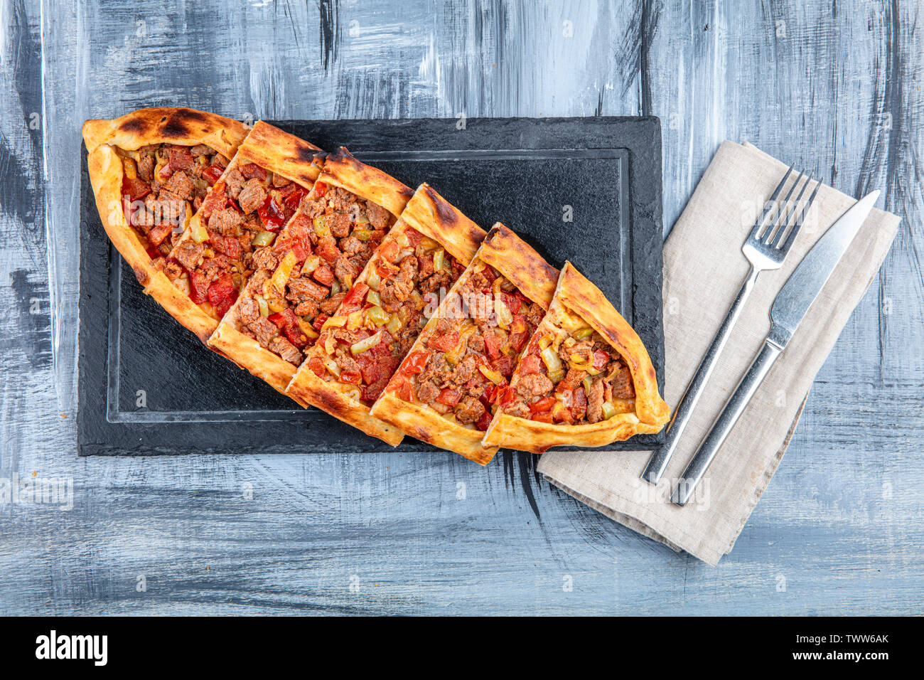 Traditional Turkish Cuisine; pide with cubed meat / kusbasili pide ...