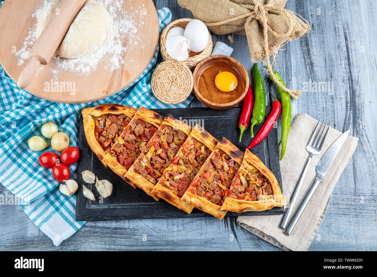 Traditional Turkish Cuisine; pide with cubed meat / kusbasili pide ...