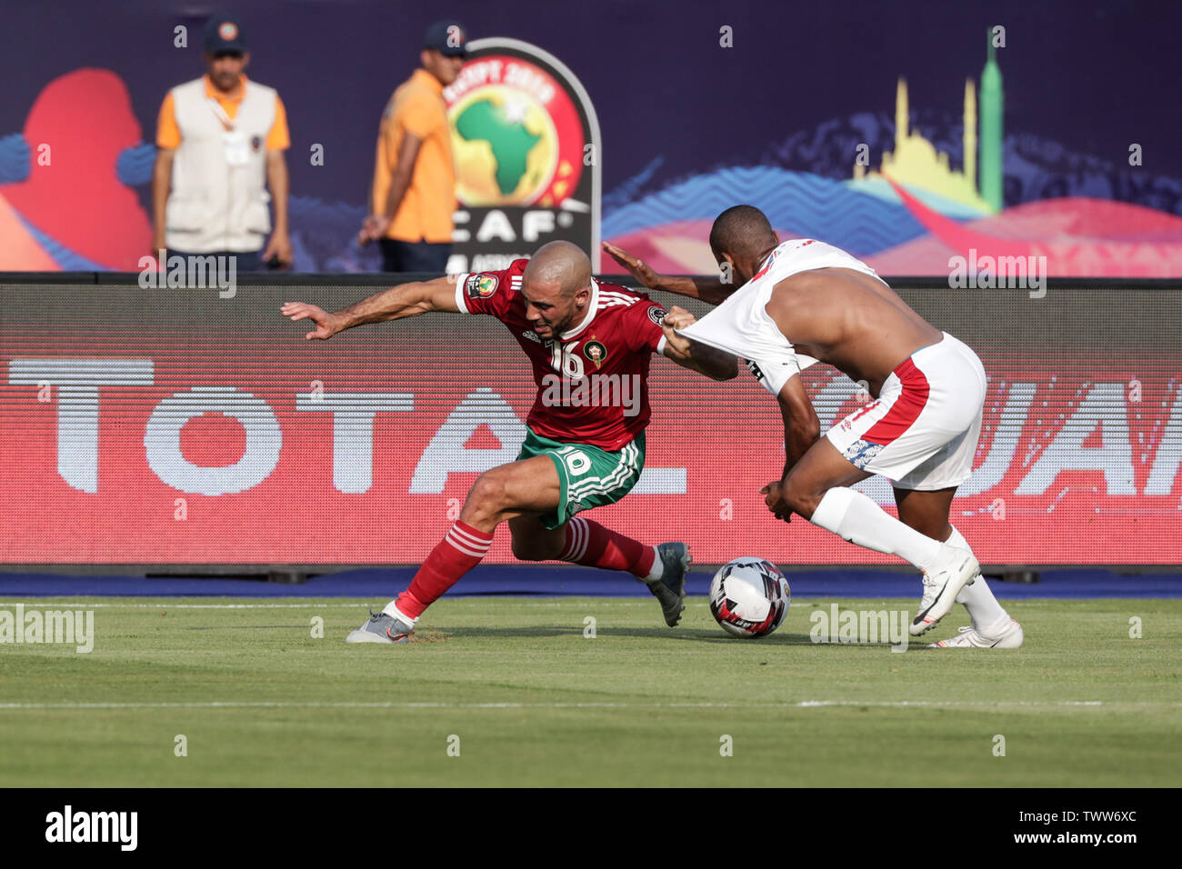 Cairo, Egypt. 23rd June, 2019. Morocco's Noureddine Amrabat (L) pulls ...