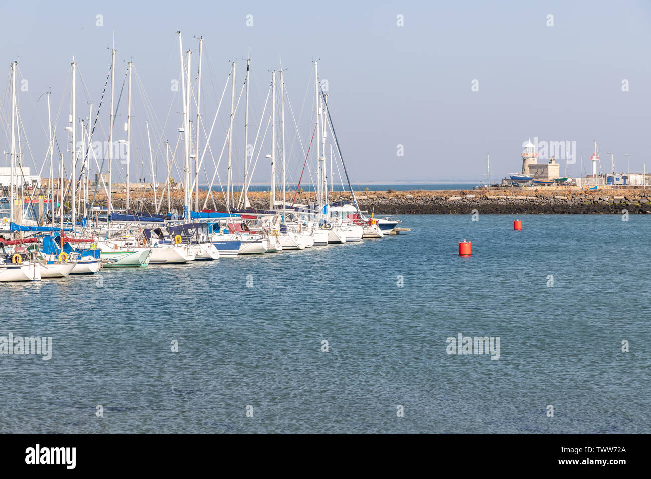 Boats and Lighthouse in Howth Pier, Howth, Dublin, Ireland Stock Photo ...