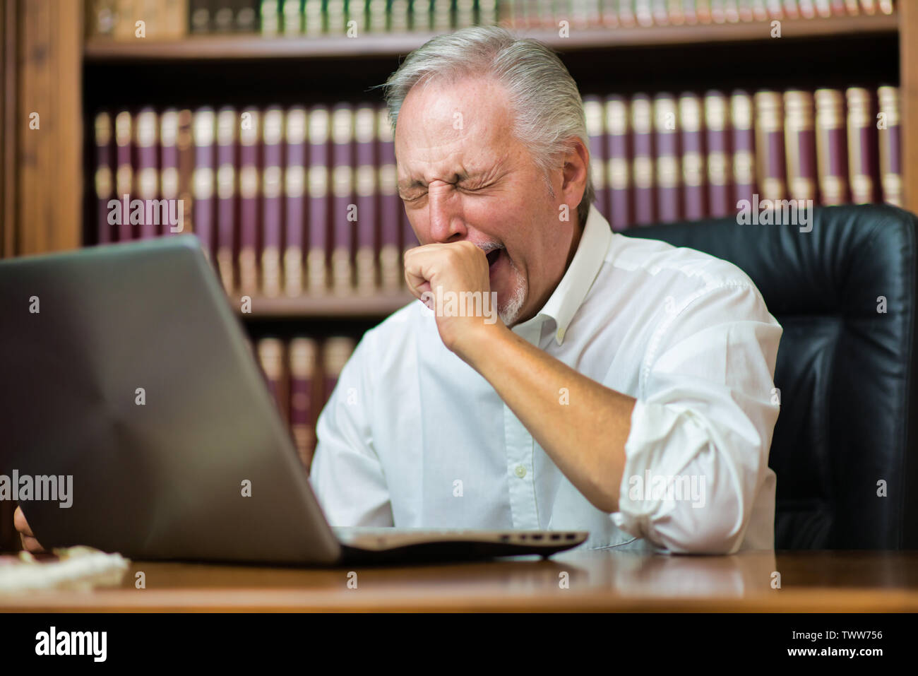 Tired business man yawning Stock Photo - Alamy Tired business man yawning Stock Photo - Alamy