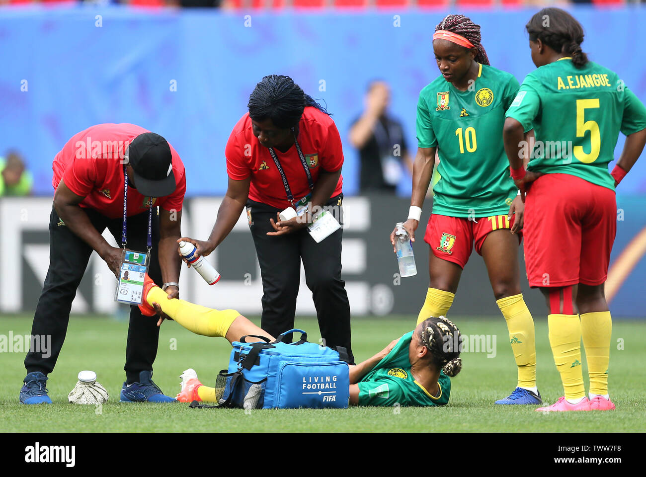 Cameroon's Estelle Johnson (centre) receives treatment during the FIFA ...