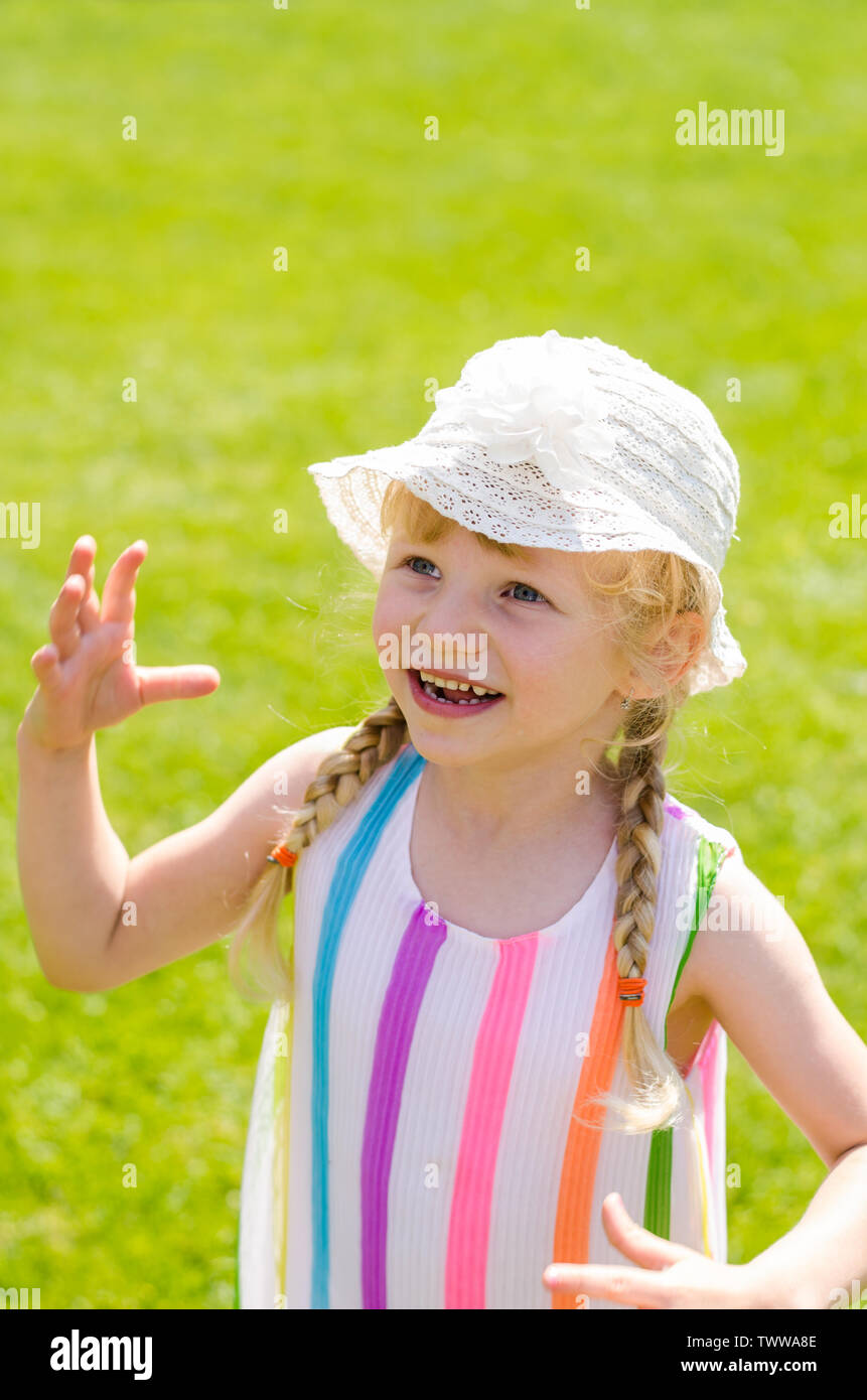 beautiful blond curious watching and waiting child Stock Photo - Alamy