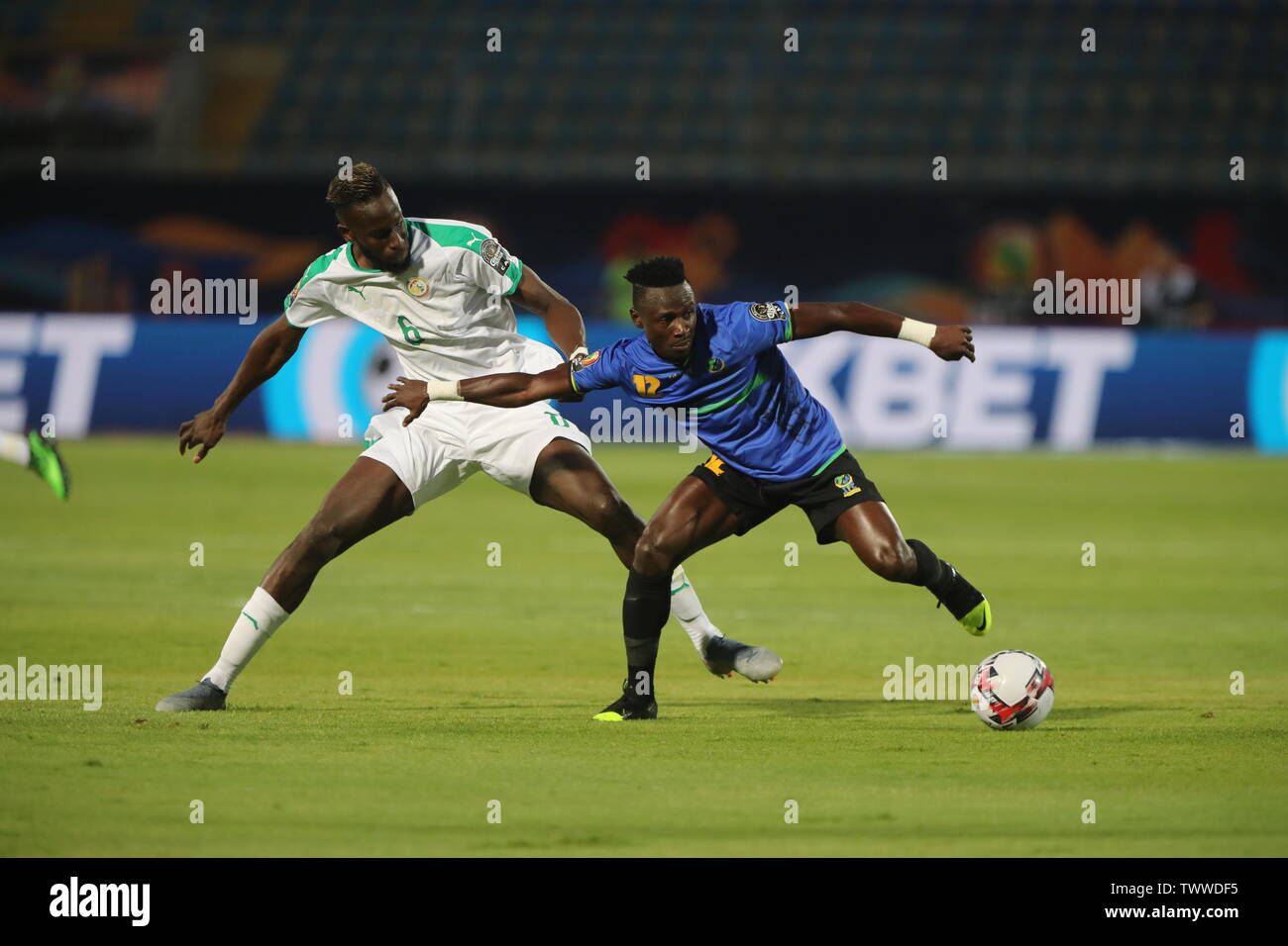 Cairo, Egypt. 23rd June, 2019. Senegal's Salif Sane and Tanzania's ...