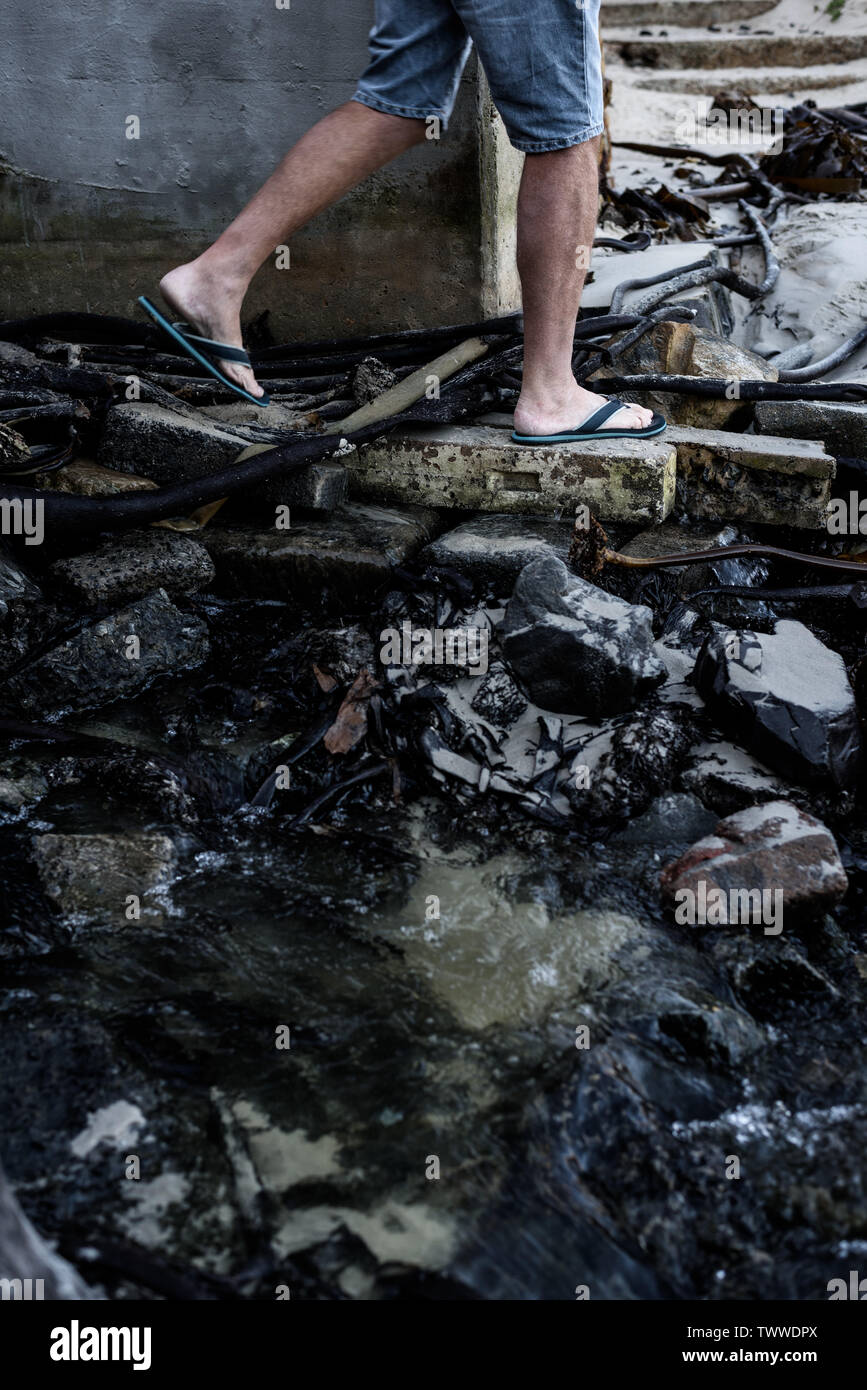 Walking under a road bridge near the coastal Cape Peninsula town of ...