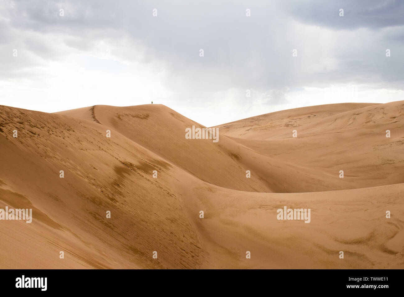 Climbing through the dunes in Great Sand Dunes National Park. The steep ...