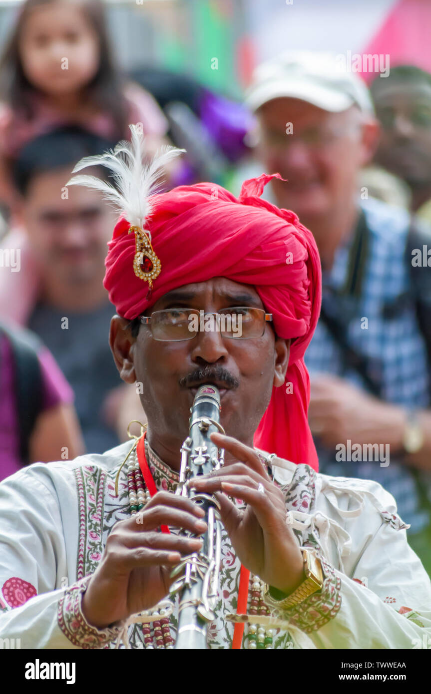 Glasgow, Scotland, UK. 23rd June, 2019. A male musician at Glasgow Mela ...