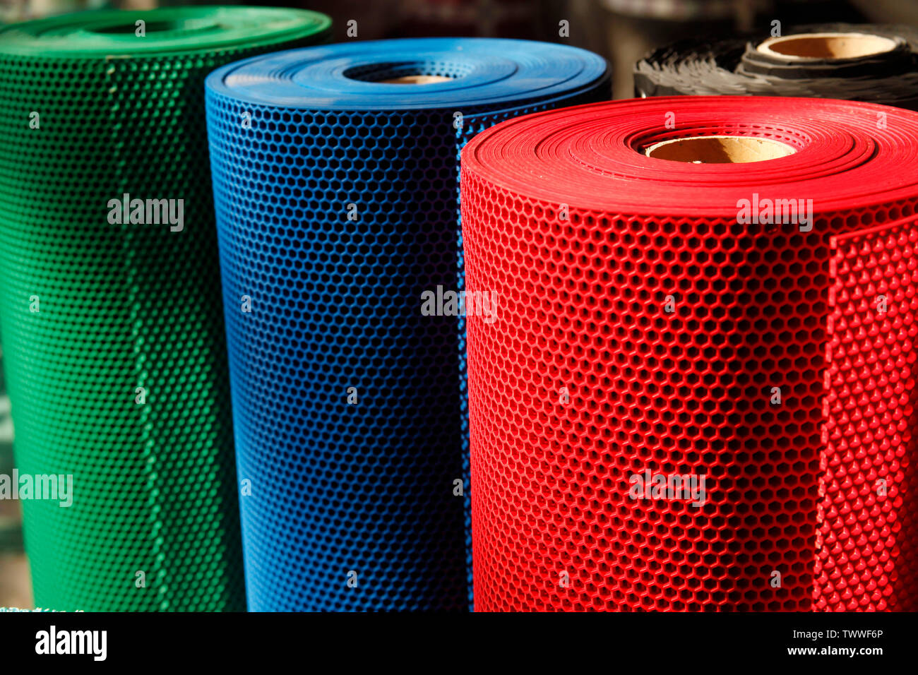 Colorful and perforated plastic grid Stock Photo - Alamy