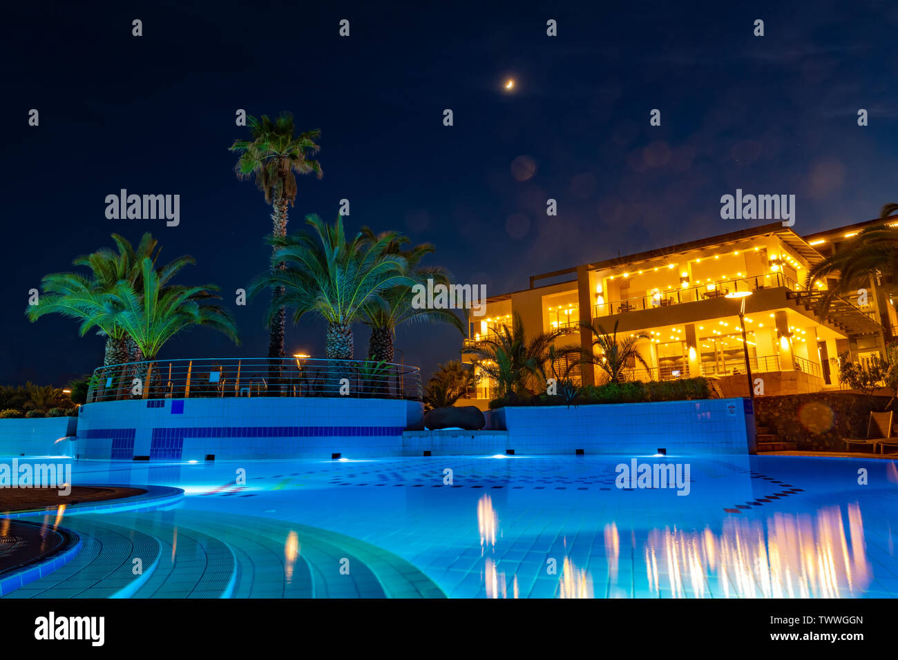 Swimming pool at a luxury tropical resort at night, dawn time Stock ...