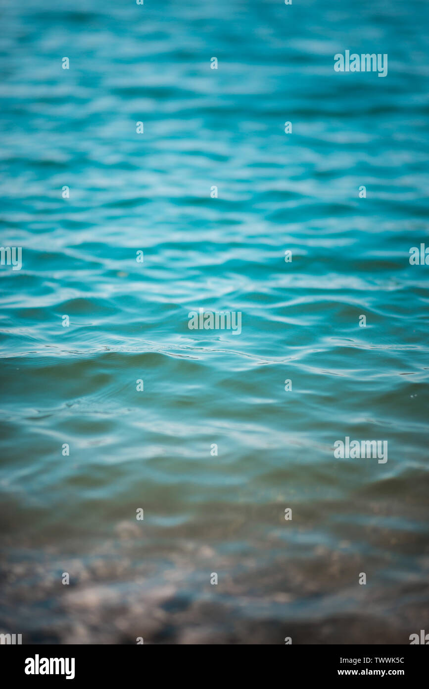 Deep blue sea beach line scene Stock Photo - Alamy