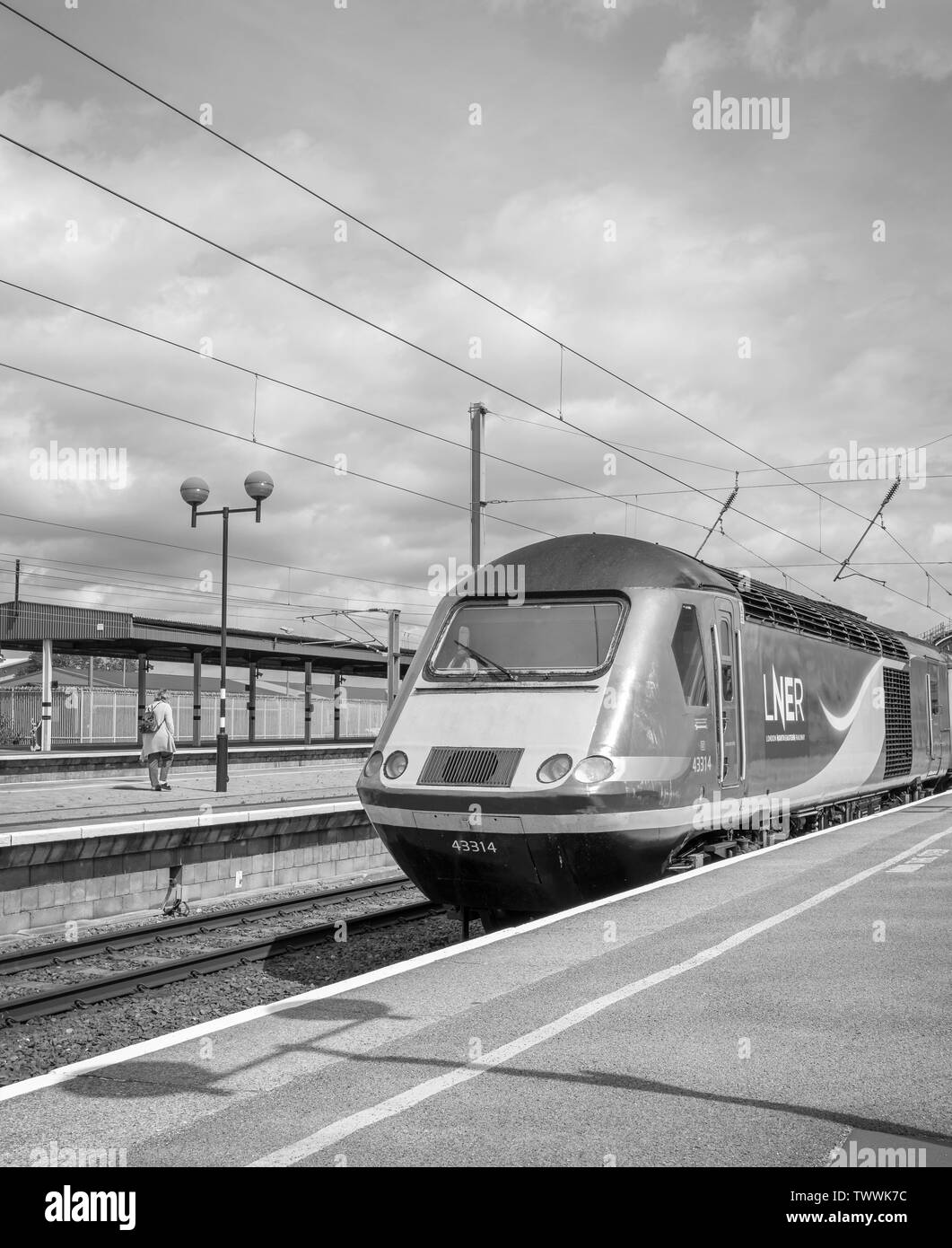 A classic view of a railway platform at York. A train waits to depart ...