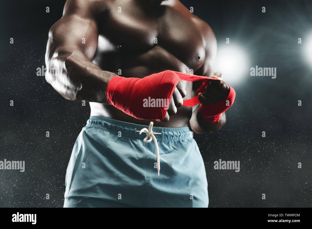 Fighter preparing for training, wrapping hands with boxing wraps Stock ...