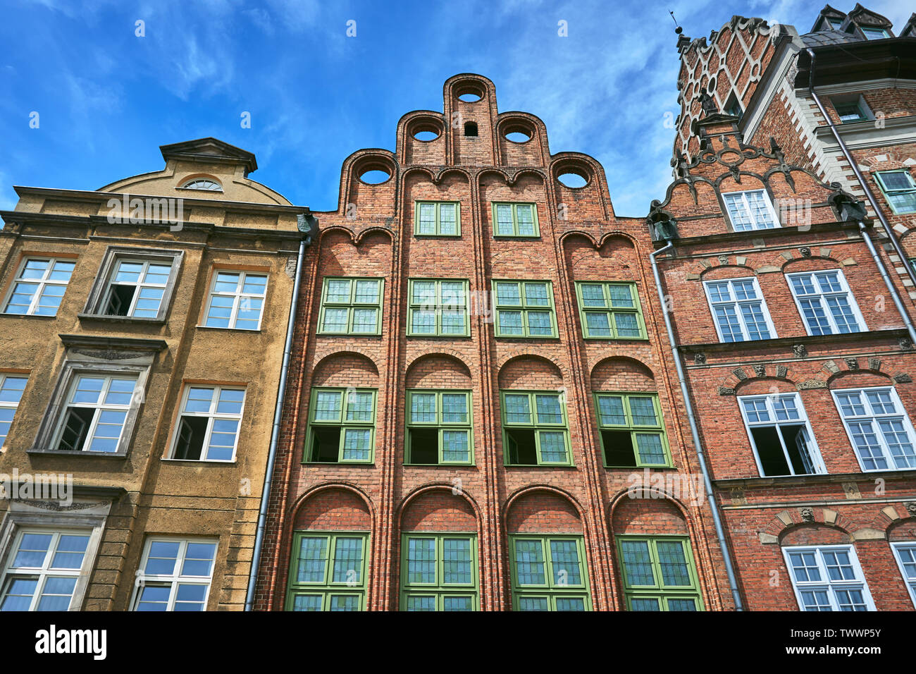 Facade historic brick tenement houses building in Gdansk Stock Photo ...