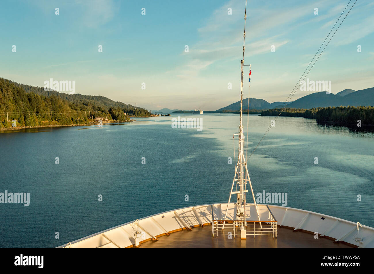 Pointed white bow of cruise ship , southbound on ocean channel, Alaska ...