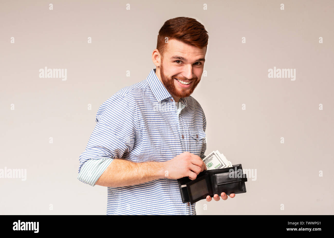 Boy holding dollar bill hi-res stock photography and images - Alamy