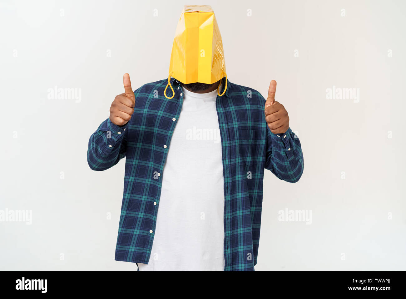 Man in paper bag on head showing with forefingers isolated on white ...