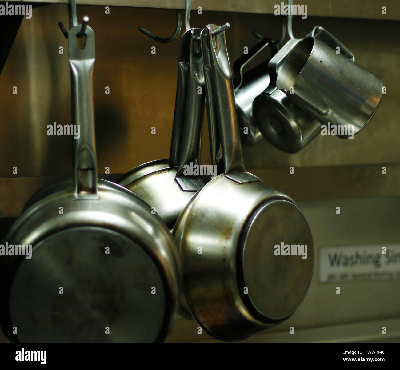 Hanging cast iron pans hi-res stock photography and images - Alamy